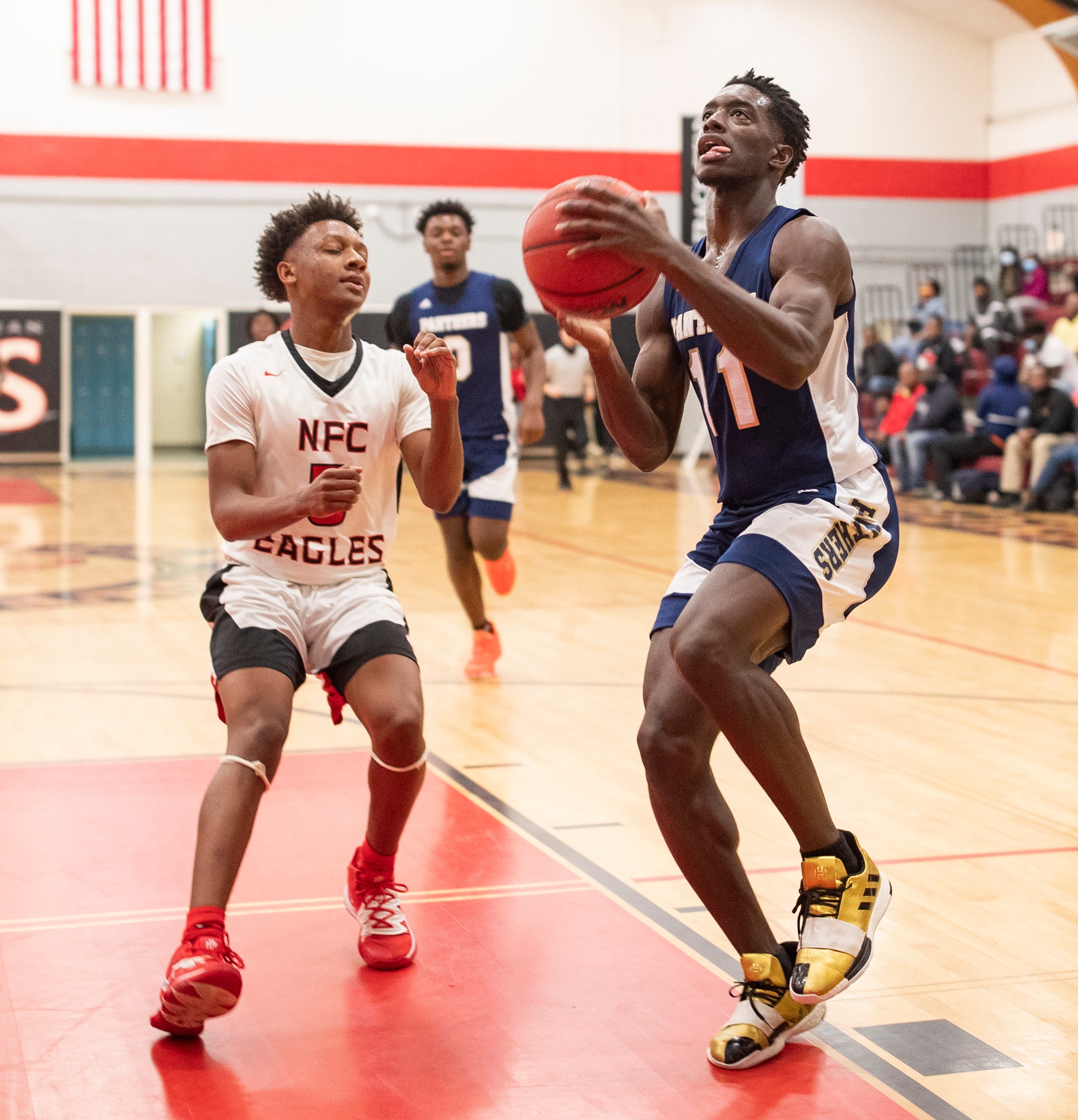 Arnold showcases equal dominance on the gridiron and hardwood