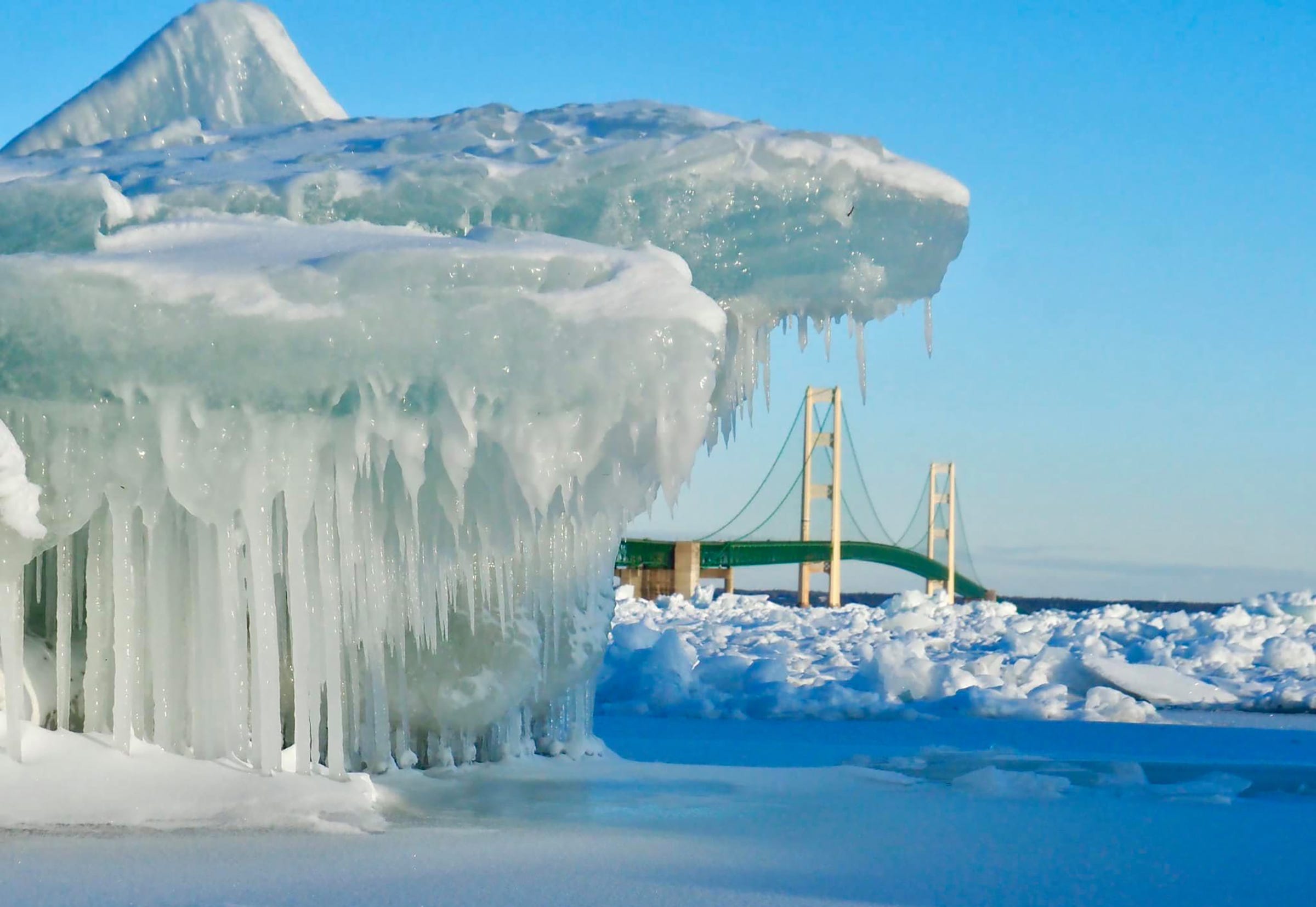 Glittering blue ice draws many to Michigan's Straits of Mackinac