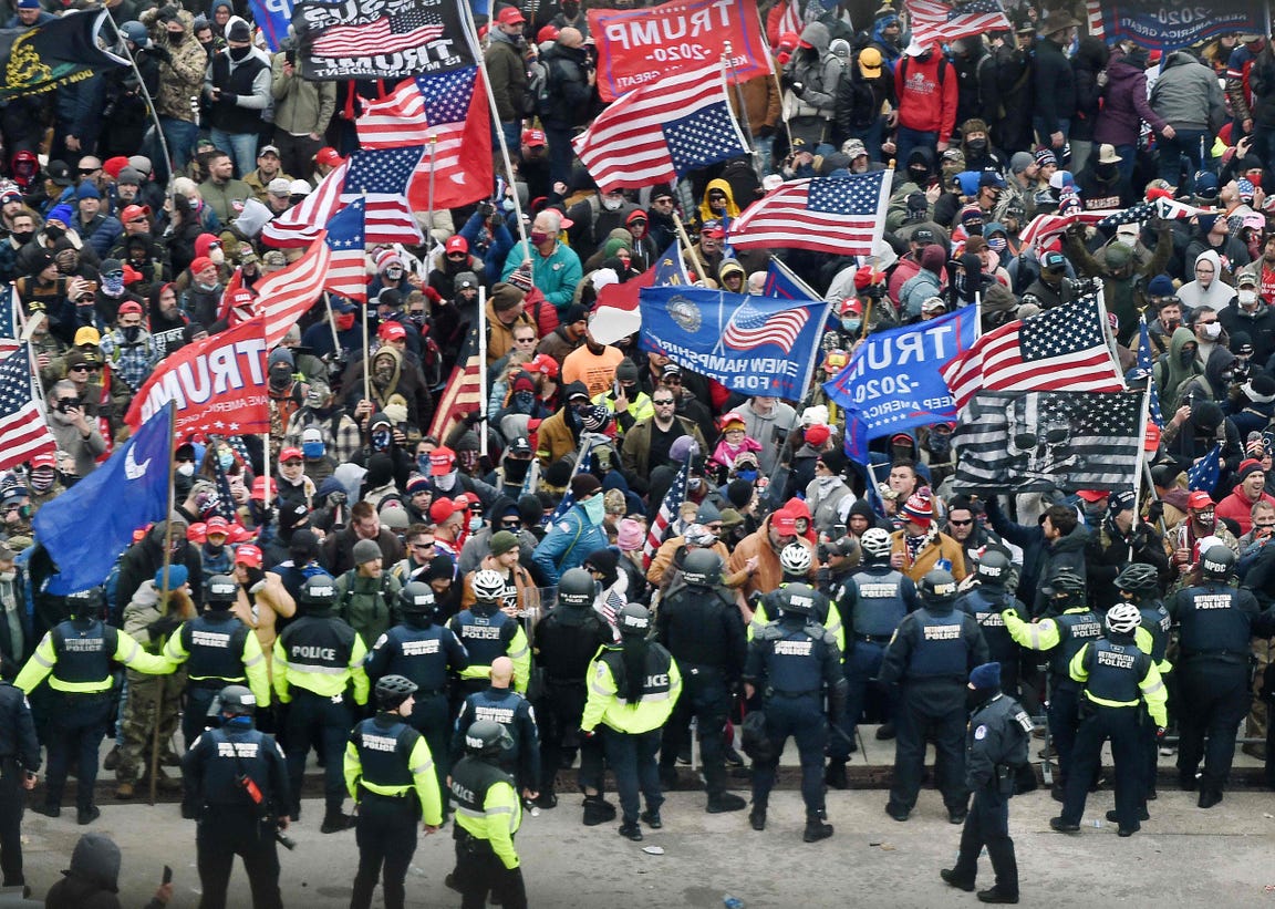 Police charged in Capitol riot reignite concerns of racism, extremism