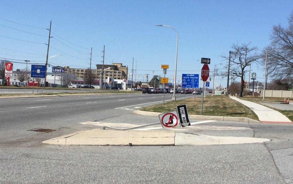 What happens when a road sign gets hit and what's the cost for DelDOT