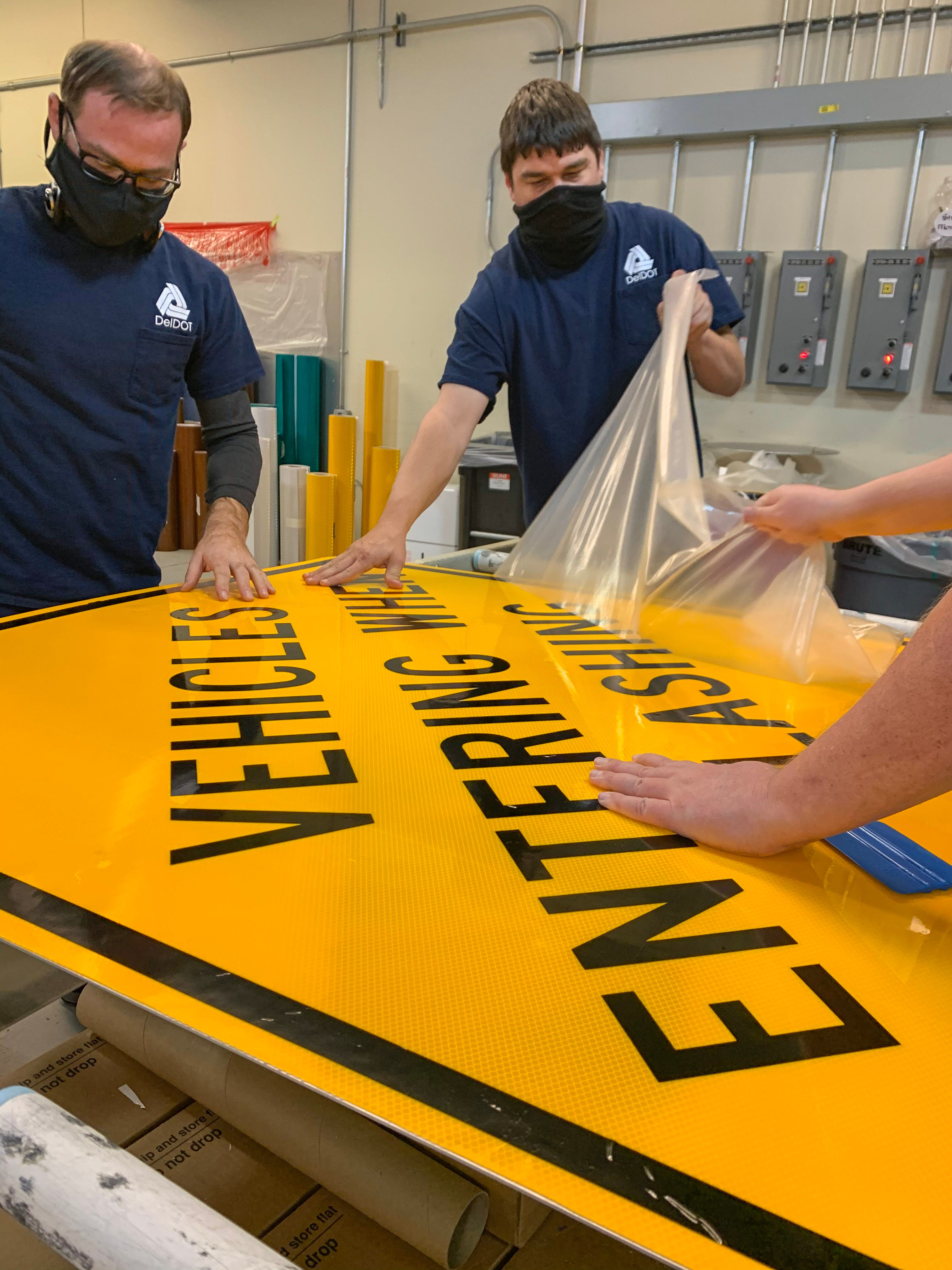 What happens when a road sign gets hit and what's the cost for DelDOT