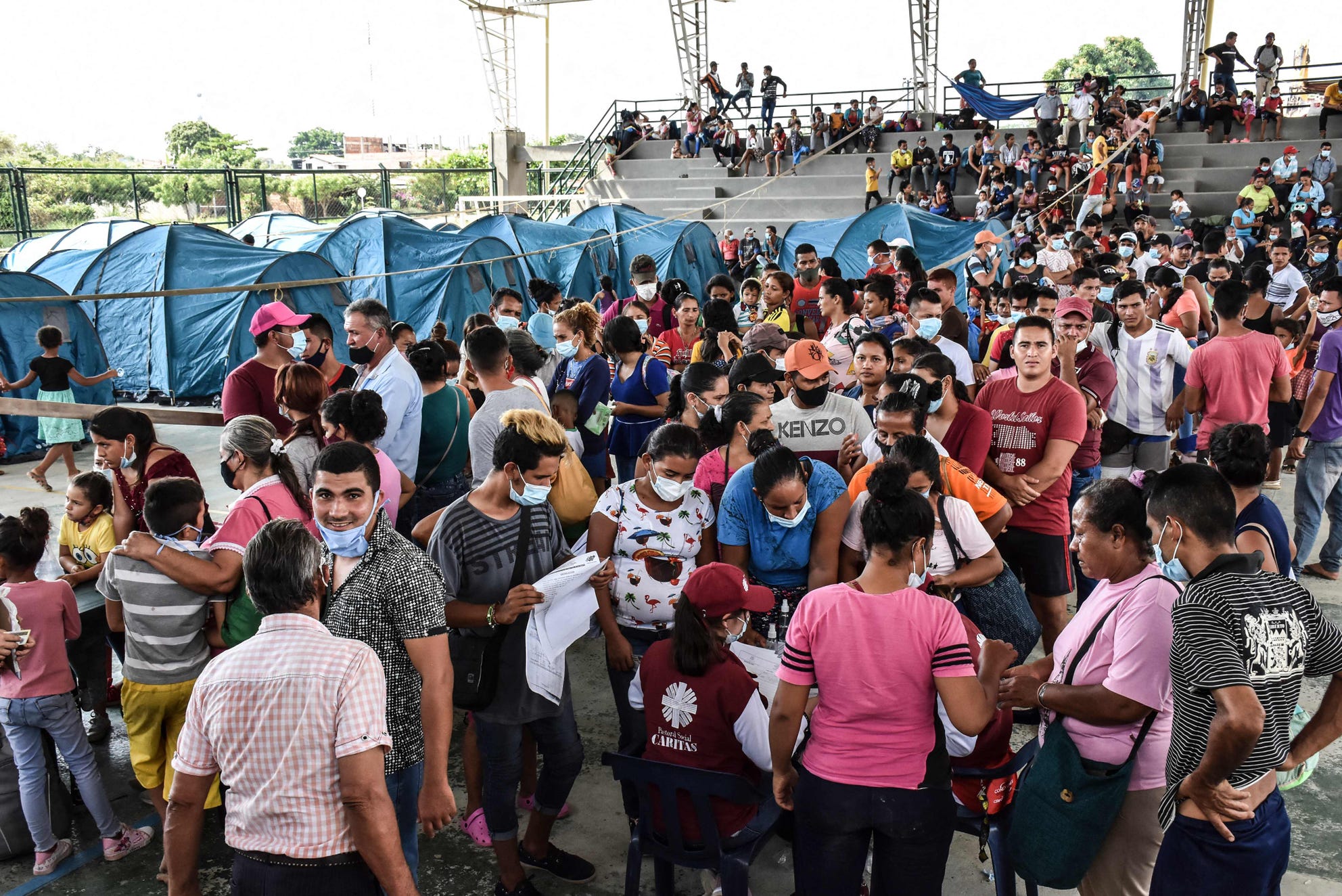 Colombia opens to Venezuelan migrants as Biden slips on immigration