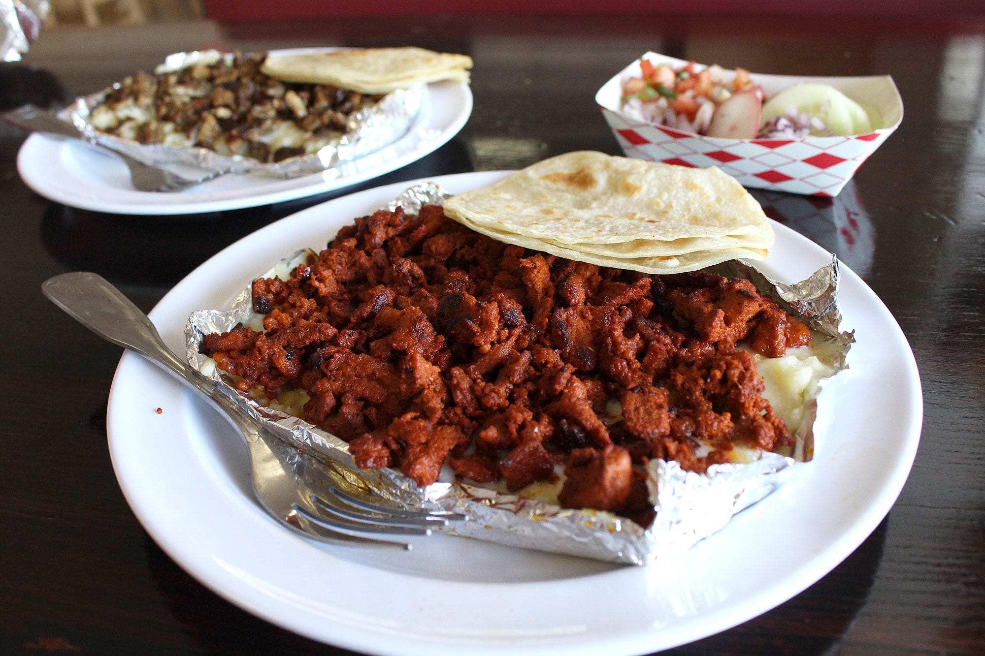 You must try the Sonoran-style baked potatoes at Los Mayitos in Mesa