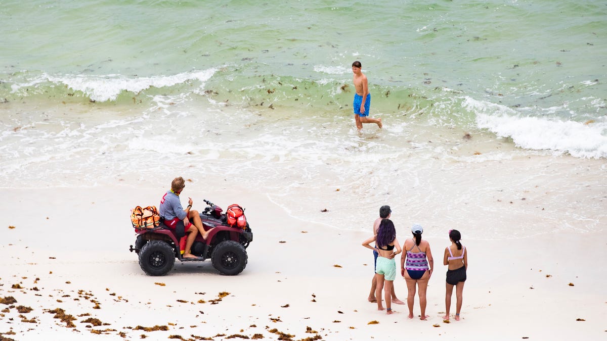 Double red flags keep lifeguards busy trying to keep people out of the Gulf