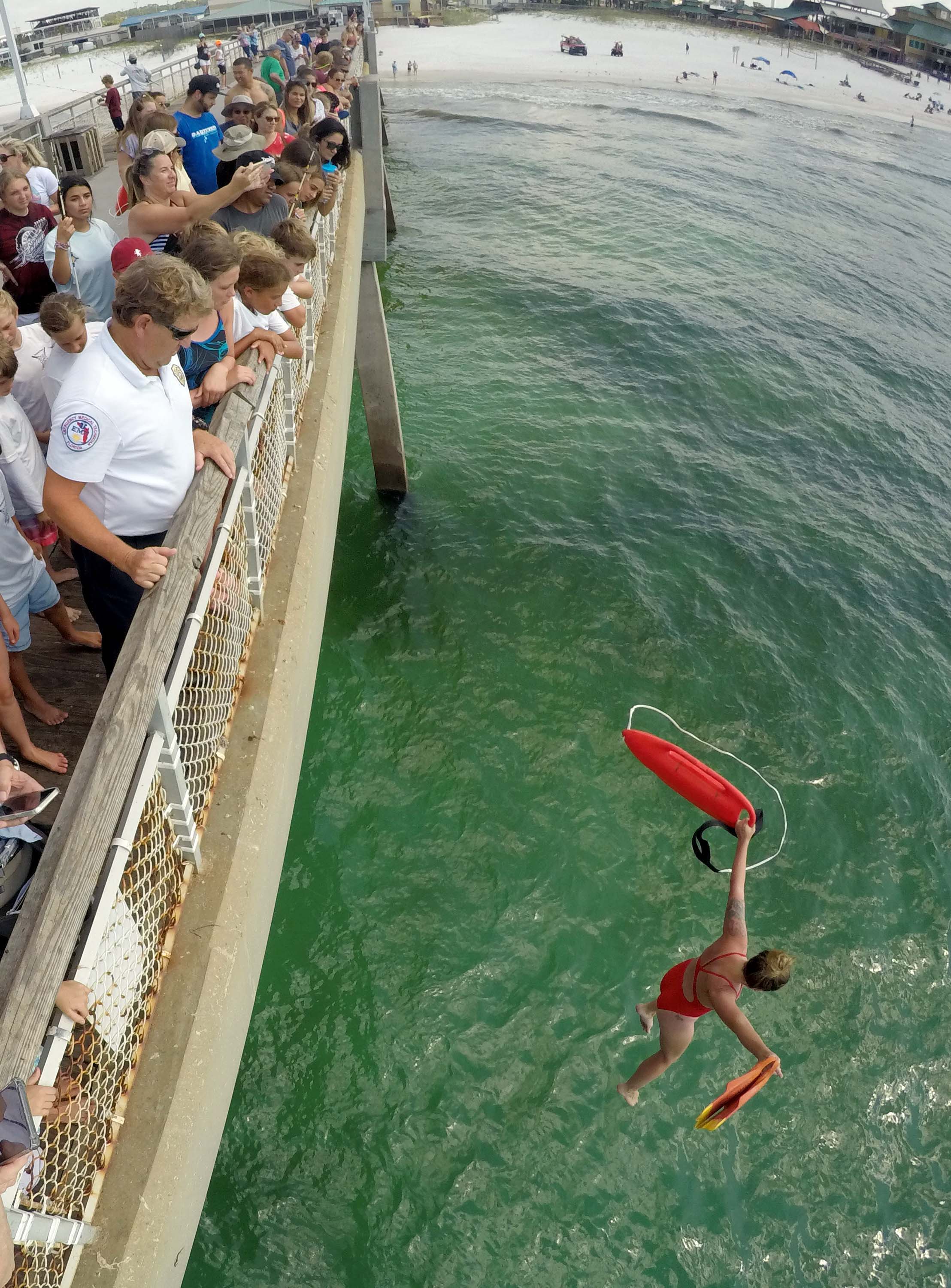 Junior lifeguards celebrate graduation with plunge from Okaloosa Pier
