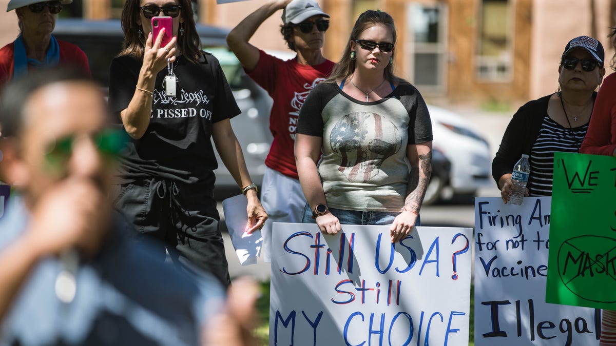 Dozens gather to protest mandatory vaccines for healthcare workers