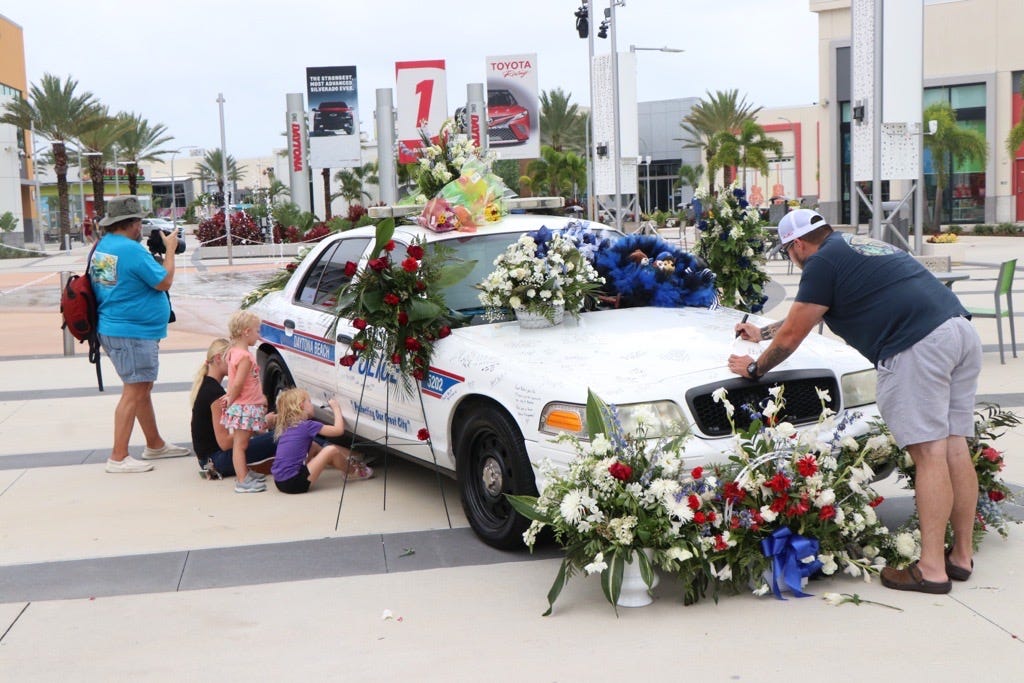 Jason Raynor, murdered Daytona Beach policeman, honored outside Nascar race