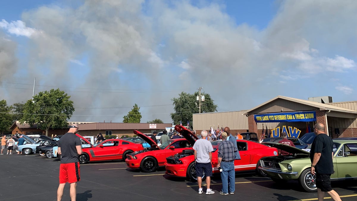 Industrial fire sets backdrop for car show honoring veterans