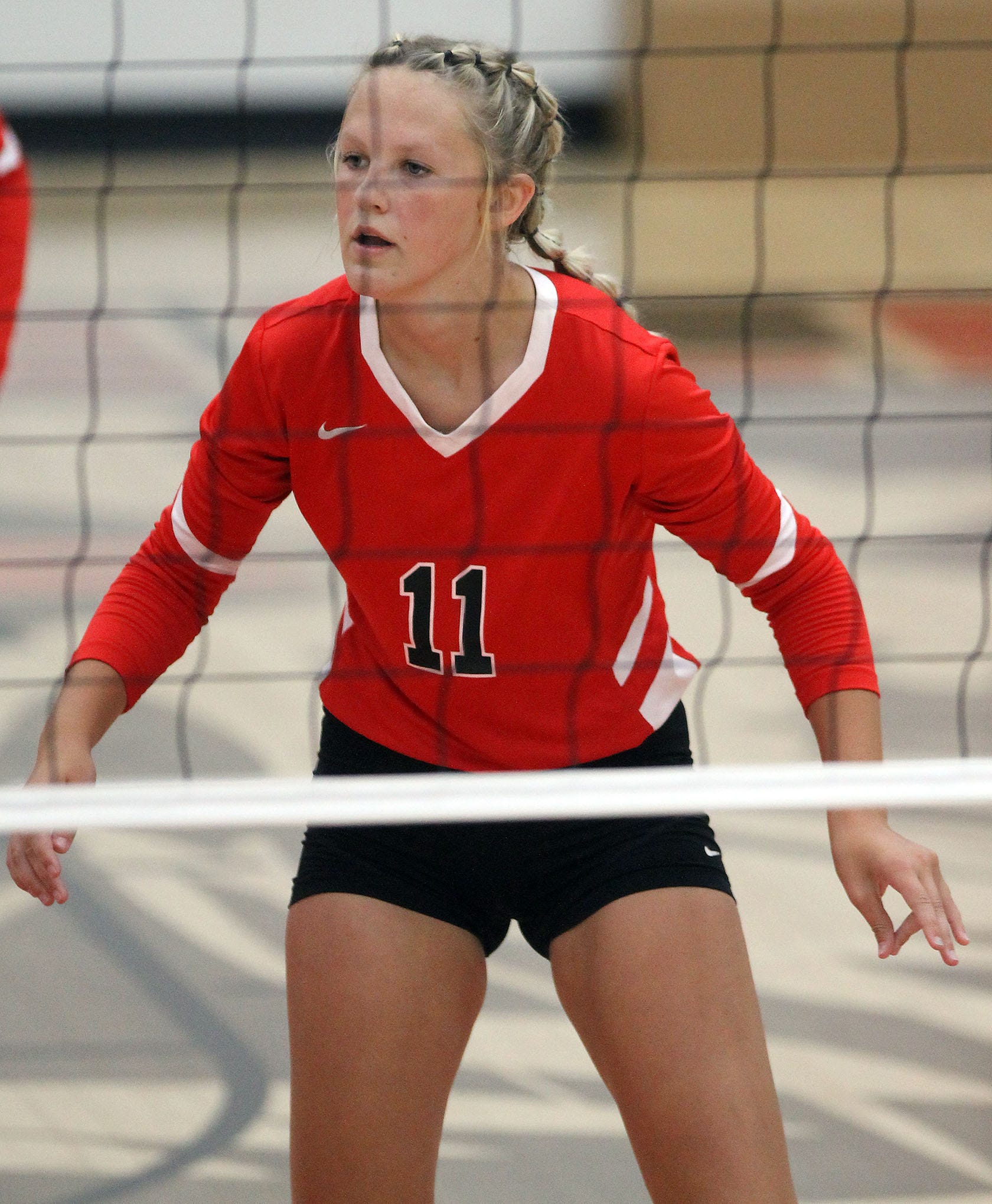 Natalie Allison moves to a new position for Mansfield volleyball