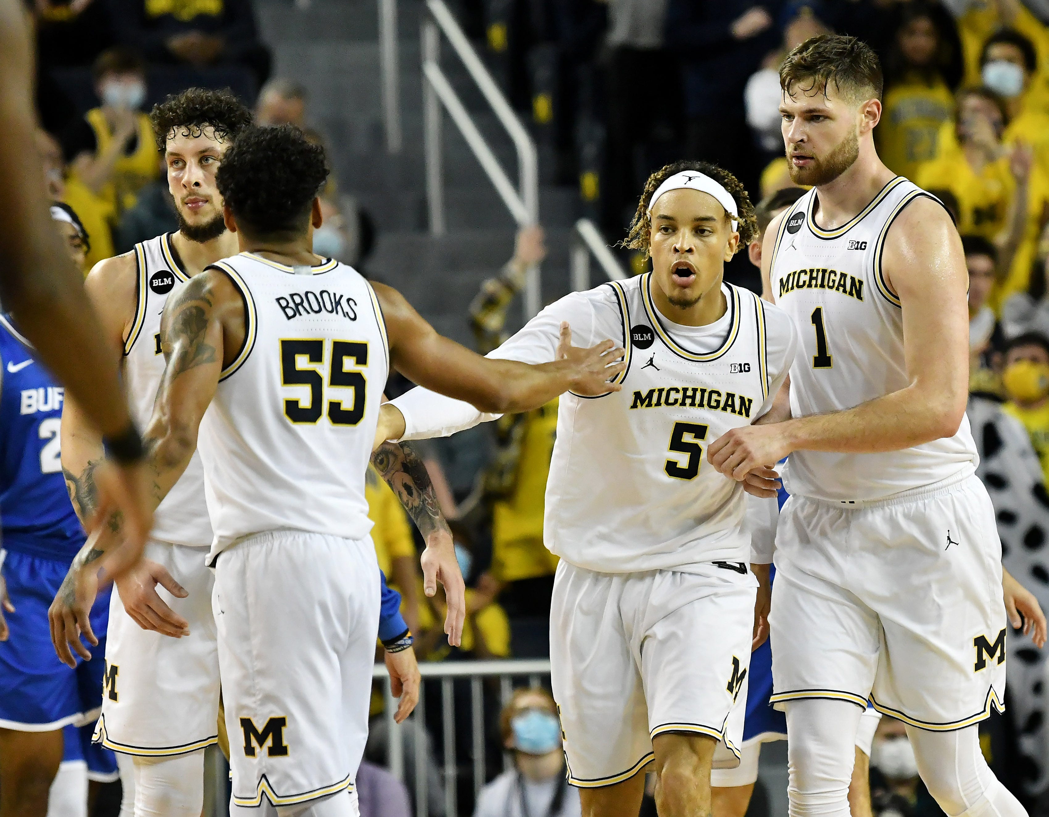 'Beautiful': Banner raised, No. 6 UM impresses as fans return to Crisler
