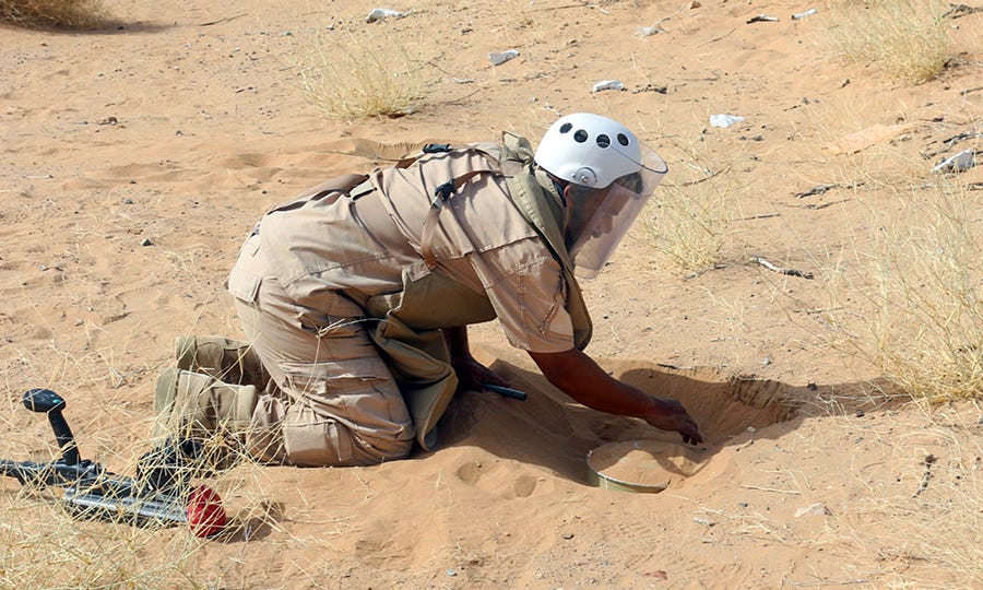 Russian leave banned land mines in Ukraine as troops withdraw