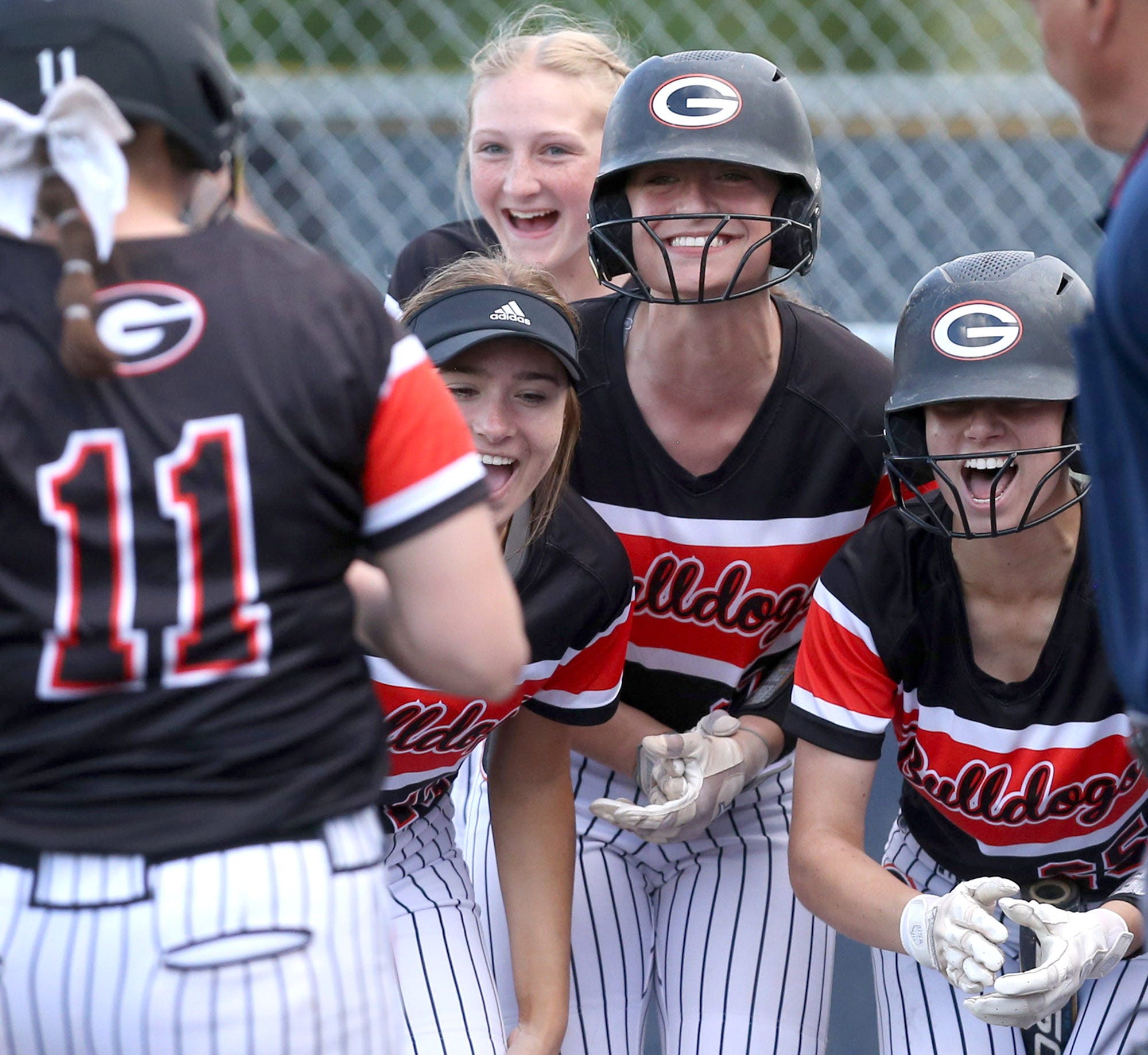 Green softball team slugs past Perry into district finals