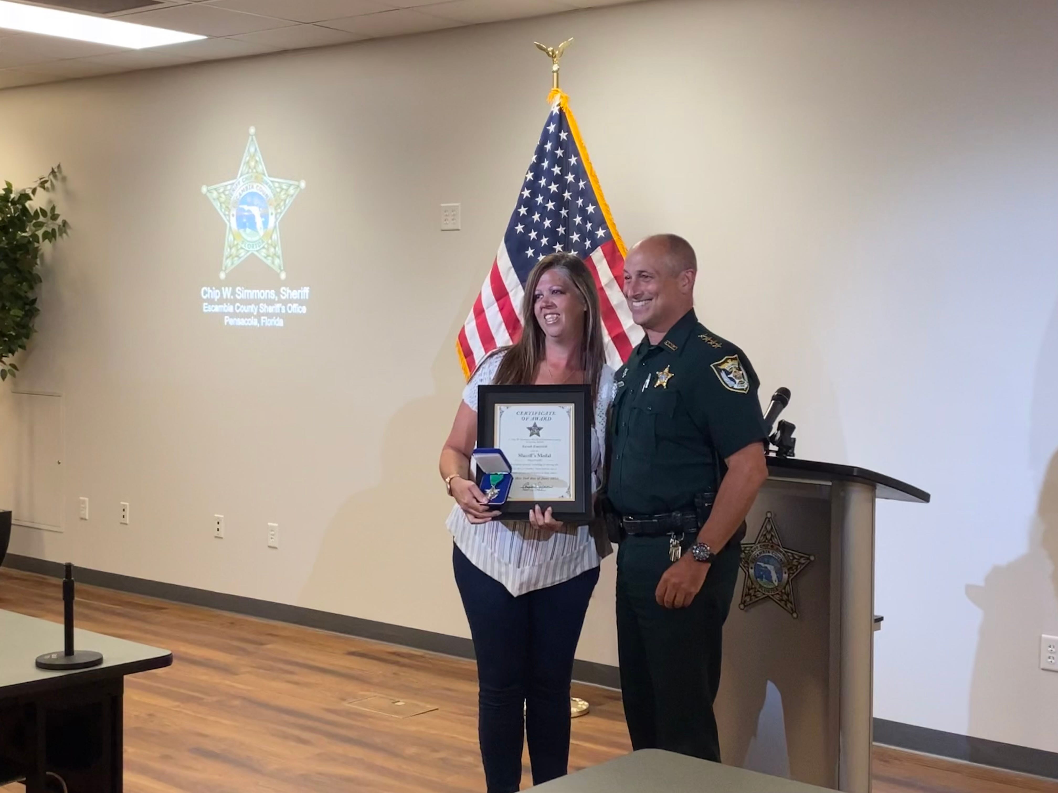 Escambia County Sheriff Chip Simmons awards three citizens with medals