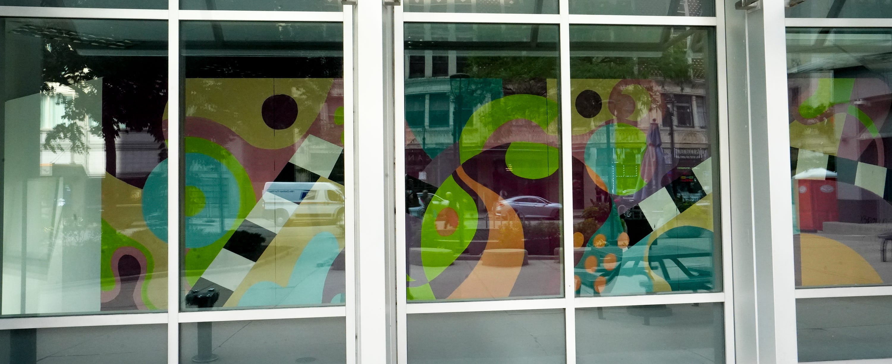 Kenosha artist Jaime Brown paints mural at Milwaukee's 310W building