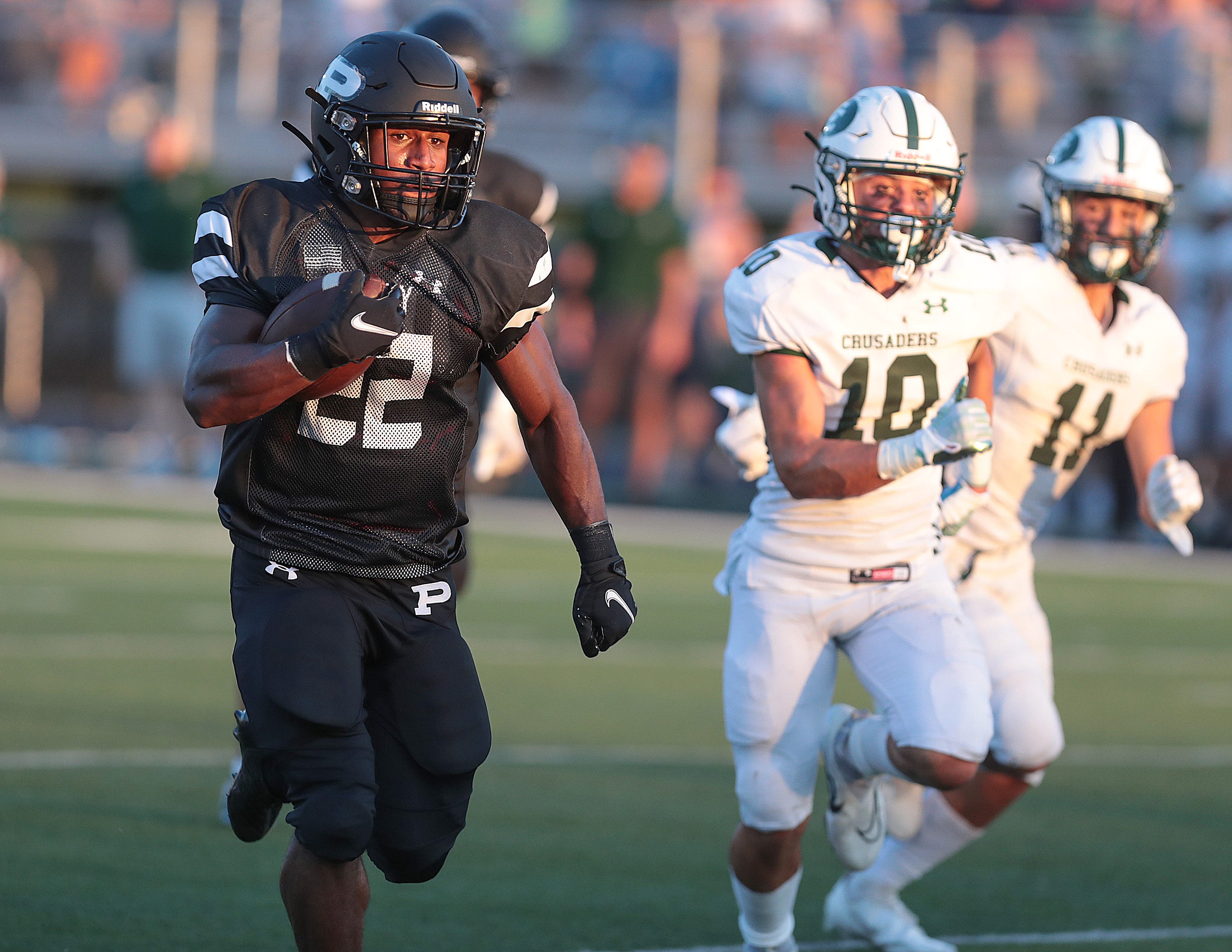 High school football: Perry runs past Central Catholic for rivalry win