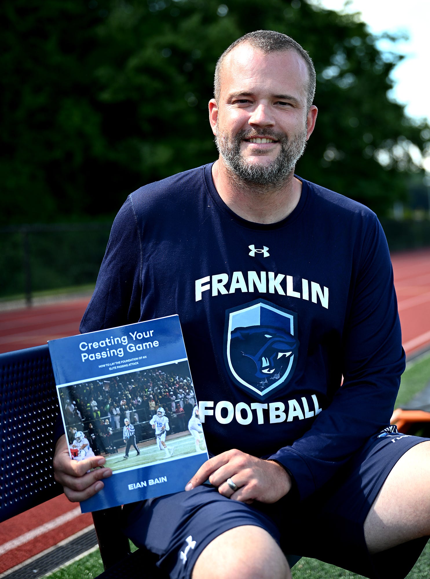Franklin football coach Eian Bain publishes first book