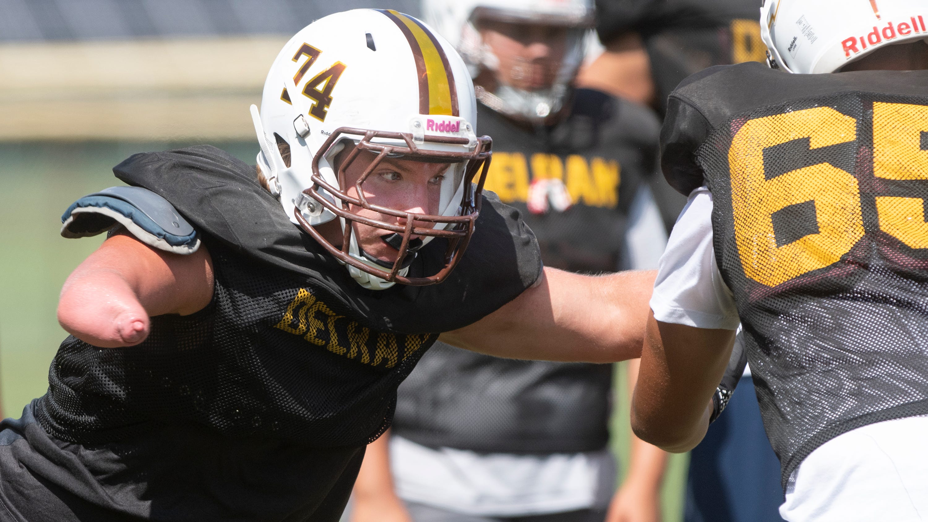 Delran football center with only one arm inspires team