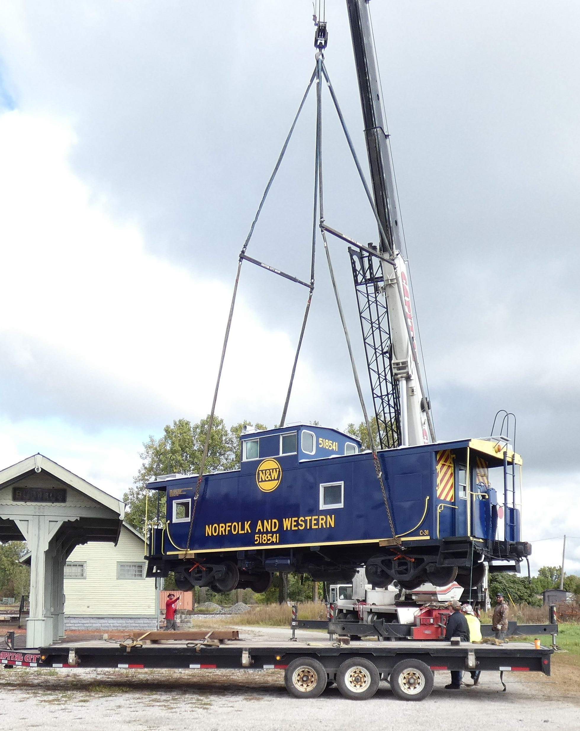 Bucyrus Preservation caboose lifted into new home outside depot