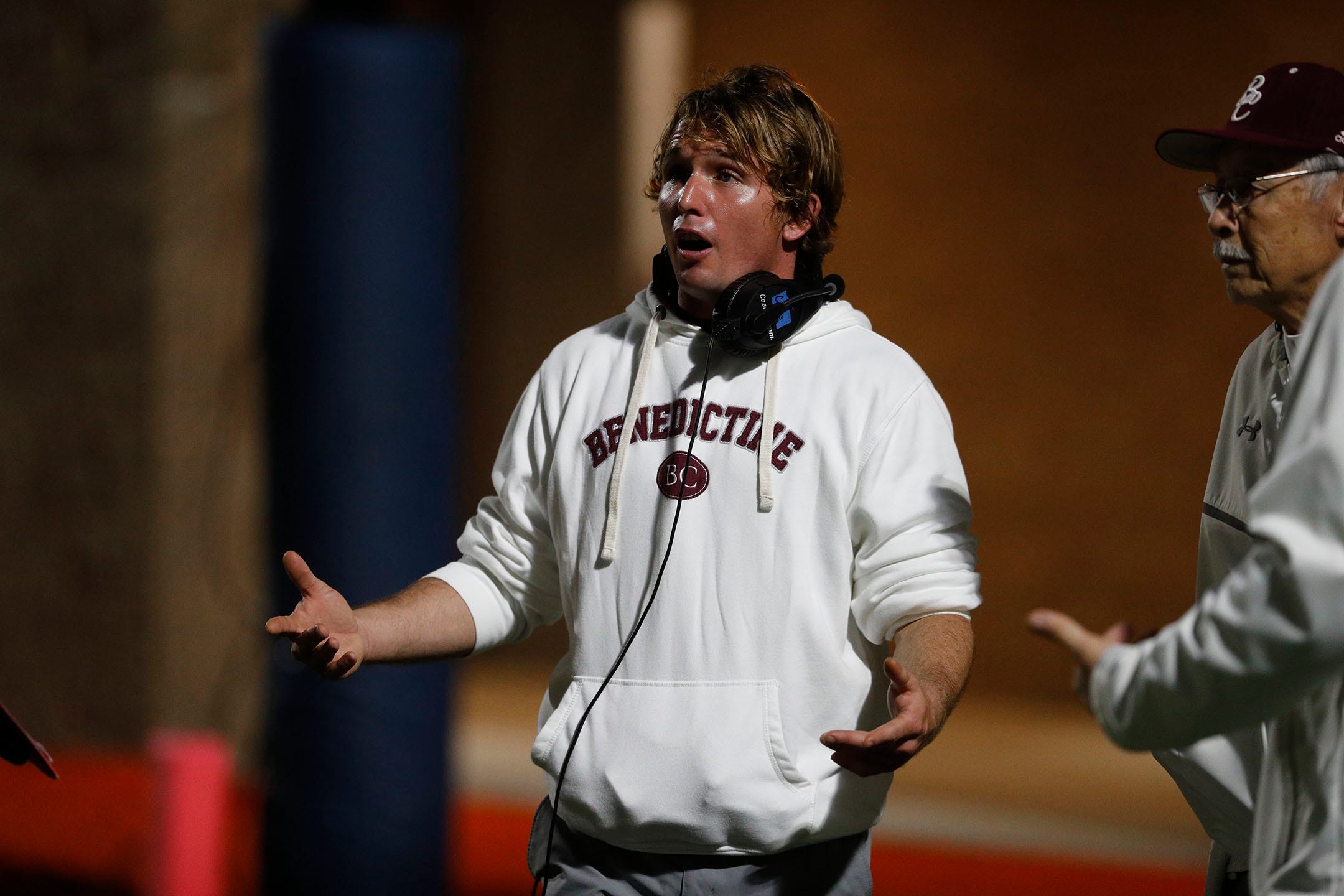 Benedictine alumnus Caleb Collins coaching football at alma mater