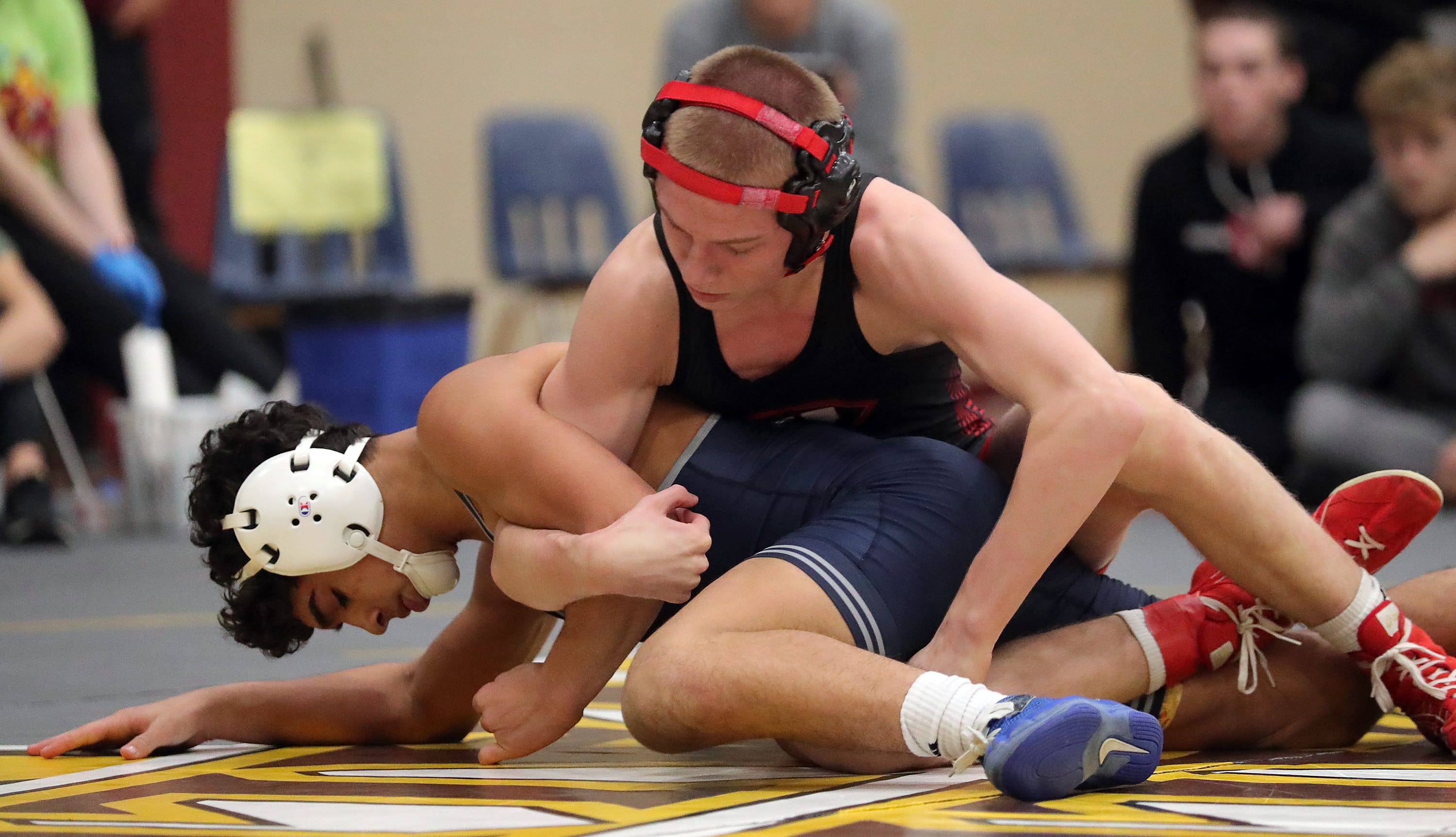 Walsh Ironman teaches hard lessons to local state champions