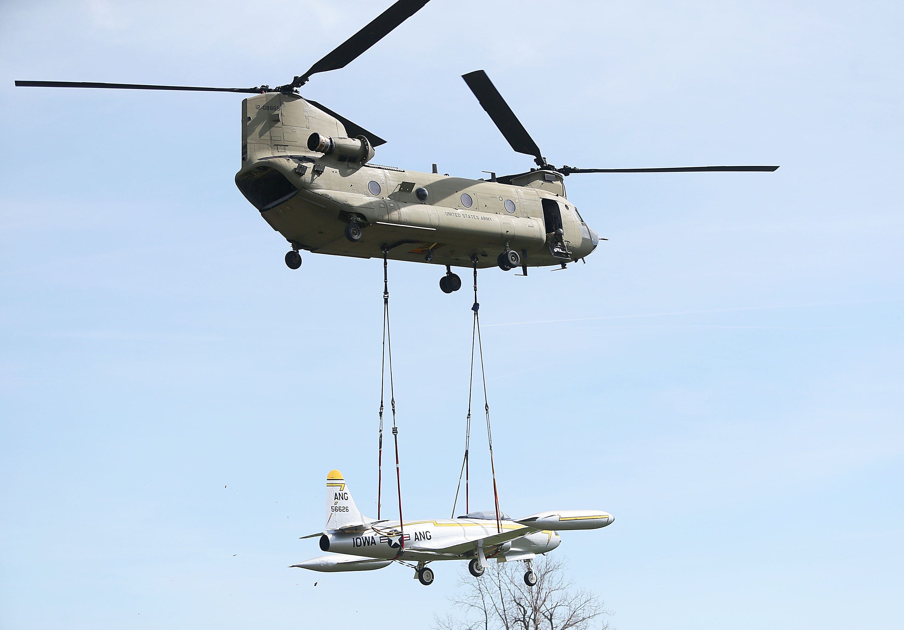 See Iowa National Guard sling load historic fighter jet across state